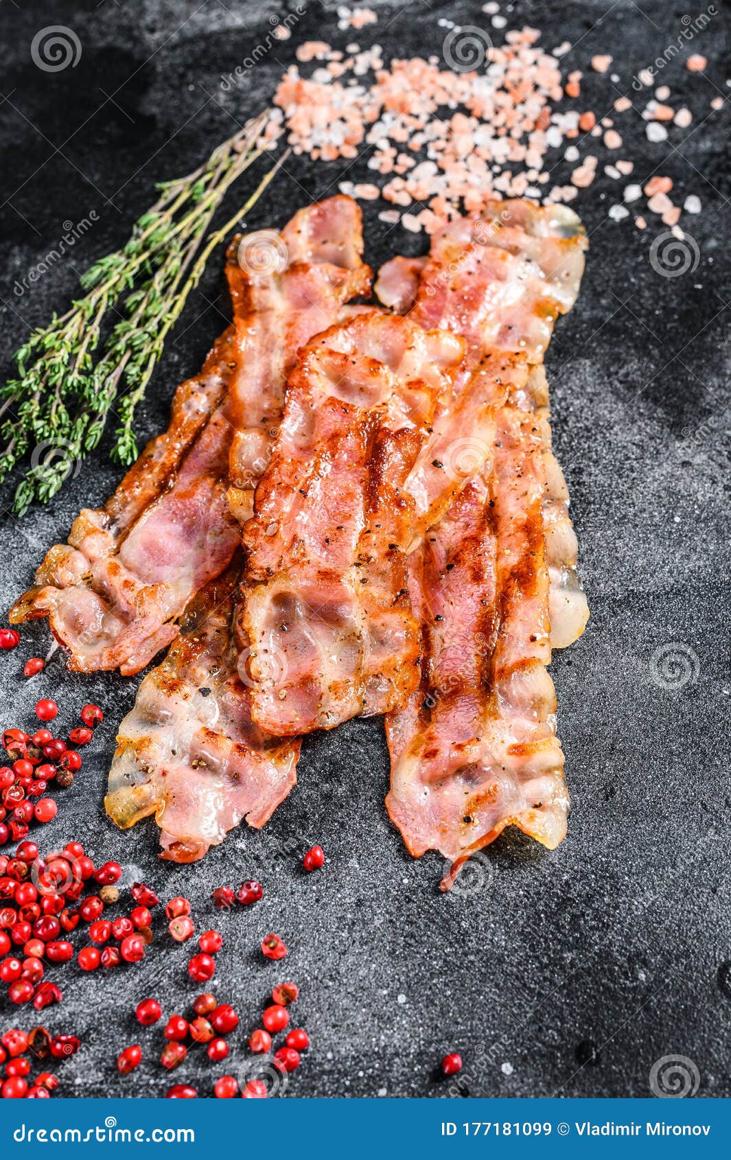 Cooked Sizzling Hot Tasty Crispy Bacon. Black Background Stock Image ...