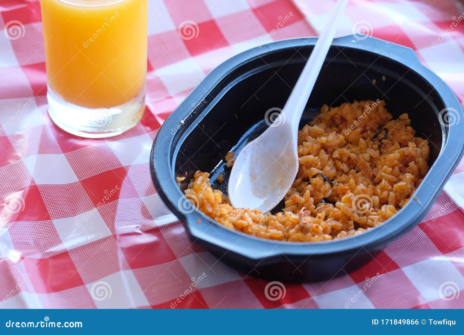 Cooked Spicy Rice in a Packet with Orange Juice on Table Stock Photo ...
