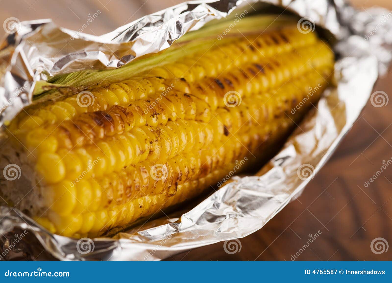 Cooked sweetcorn stock image. Image of foil, crumpled - 4765587
