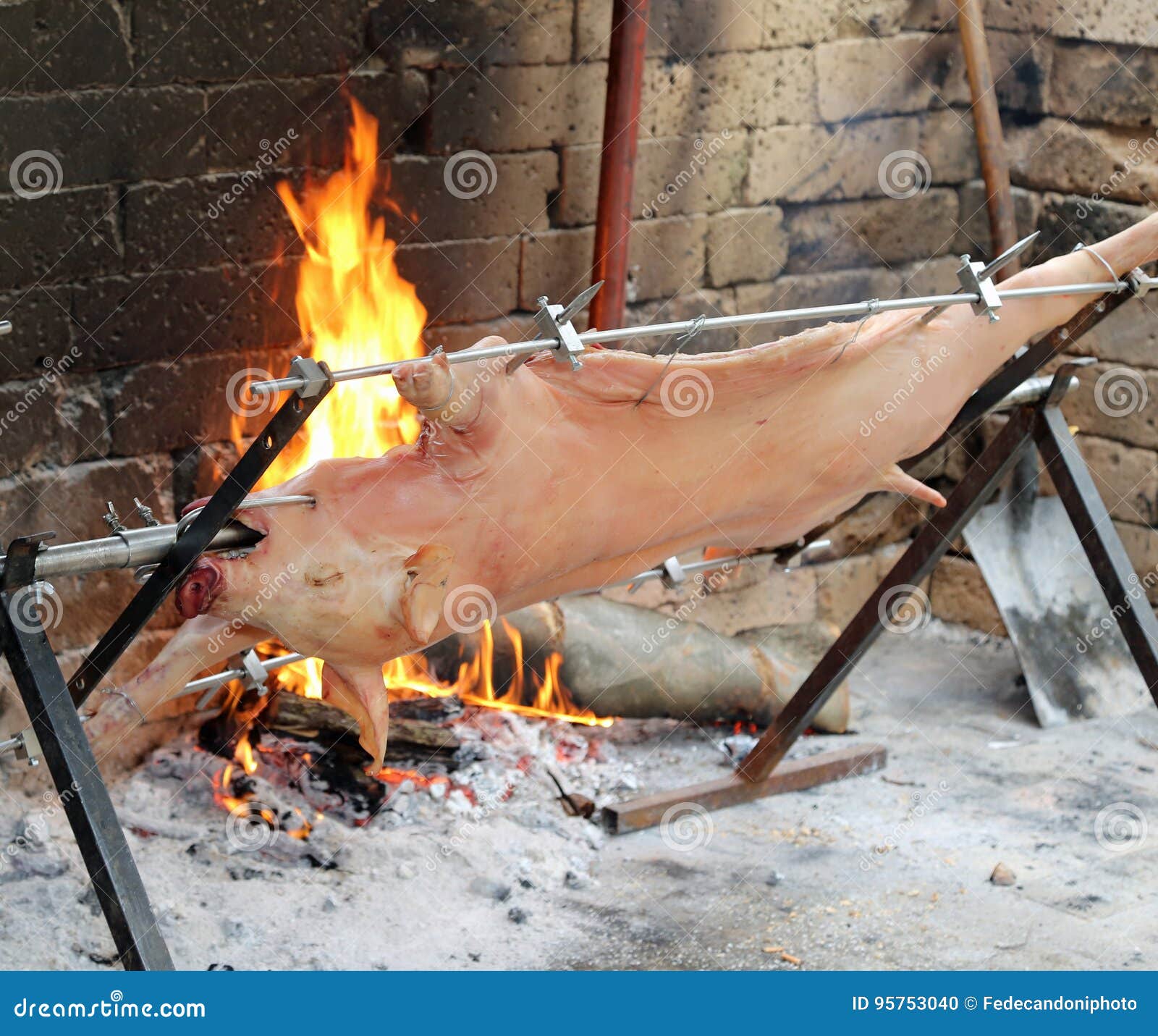 Cooked Whole Pig on a Spit with Hot Embers Stock Photo - Image of ...