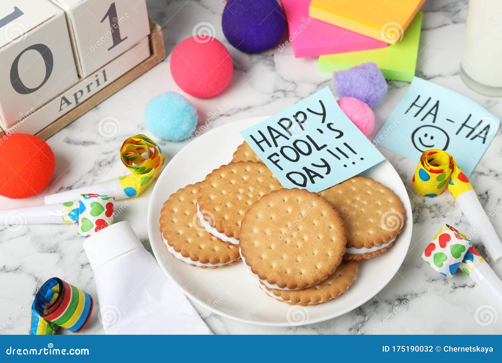 Cookies with Toothpaste and HAPPY FOOL`S DAY Note on White Marble Table ...