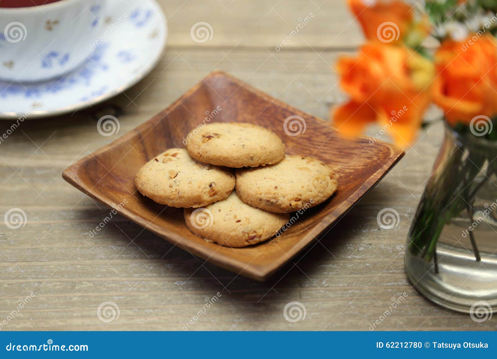Cookies on a wooden plate stock photo. Image of table - 62212780
