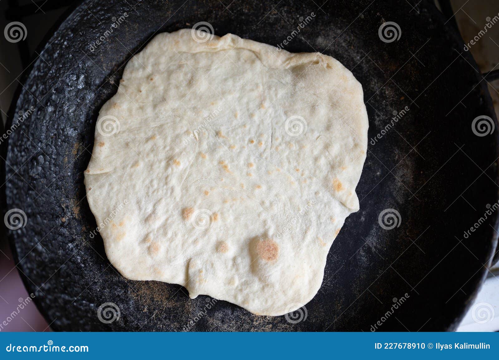 Cooking bannock on a pan stock photo. Image of cuisine - 227678910