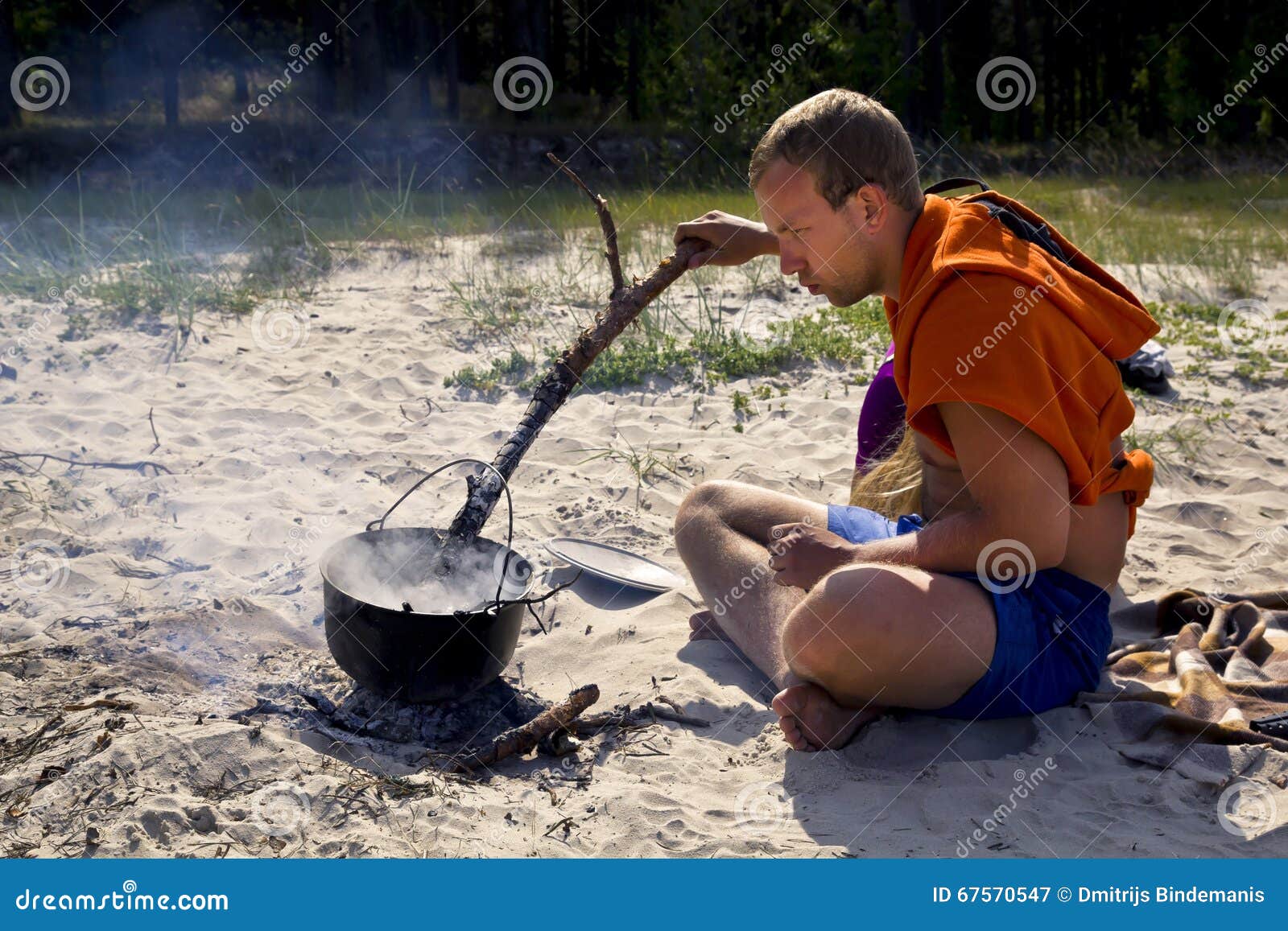 Cooking on the beach stock image. Image of exploration - 67570547