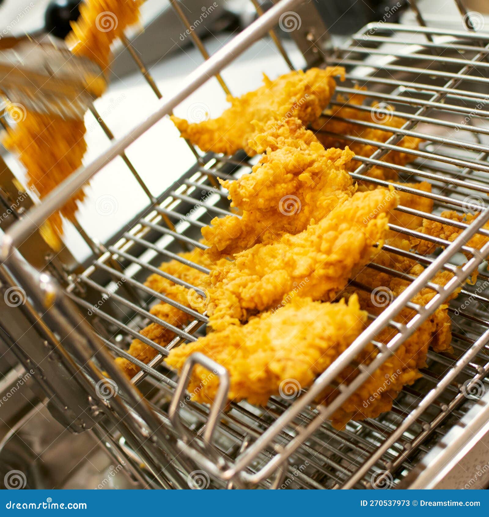 Cooking Breaded Chicken Slices in the Kitchen in Fast Food Restaurant ...