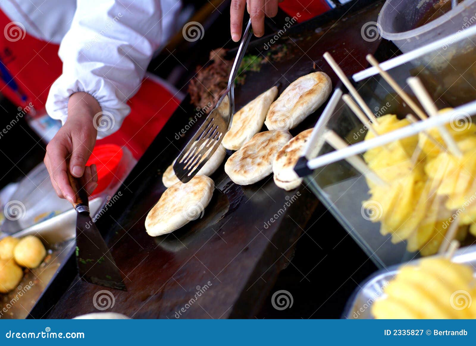 Cooking buns at the market stock image. Image of balls - 2335827