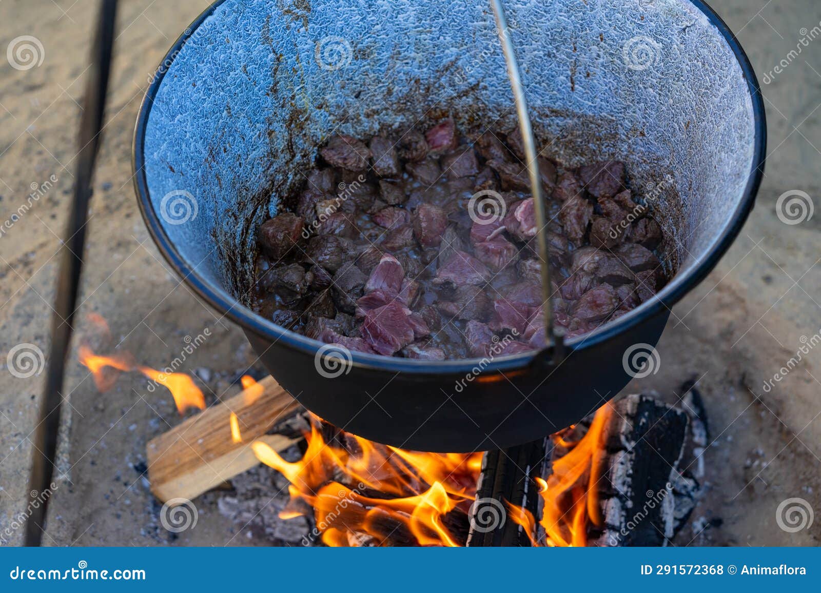 Cooking in a cast pot stock photo. Image of cauldron - 291572368