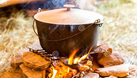 Cooking in a Cauldron on Fire Stock Image - Image of travel, camping ...