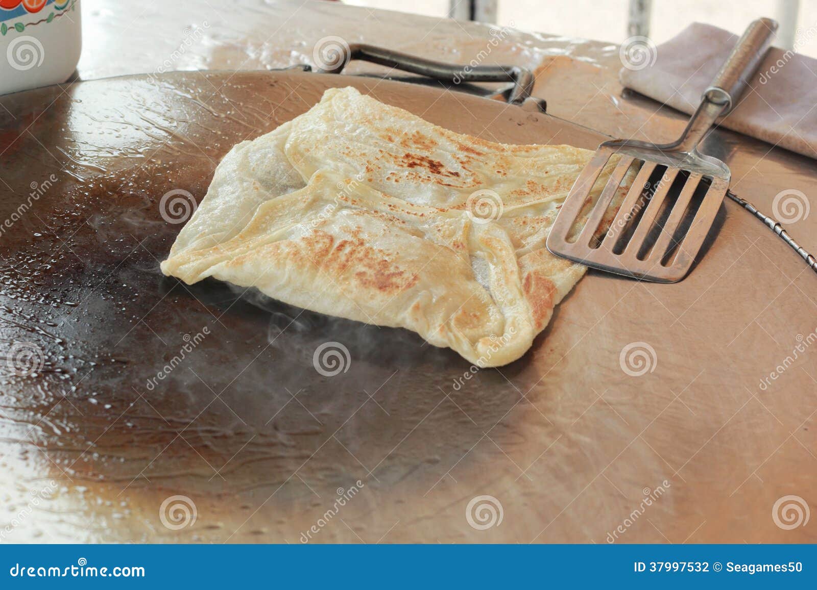 Cooking chapati on the pan stock photo. Image of diet - 37997532