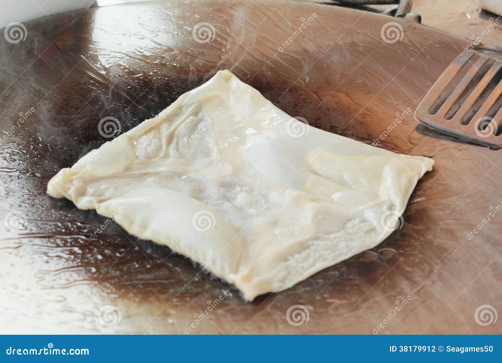 Cooking chapati on the pan stock photo. Image of french - 38179912