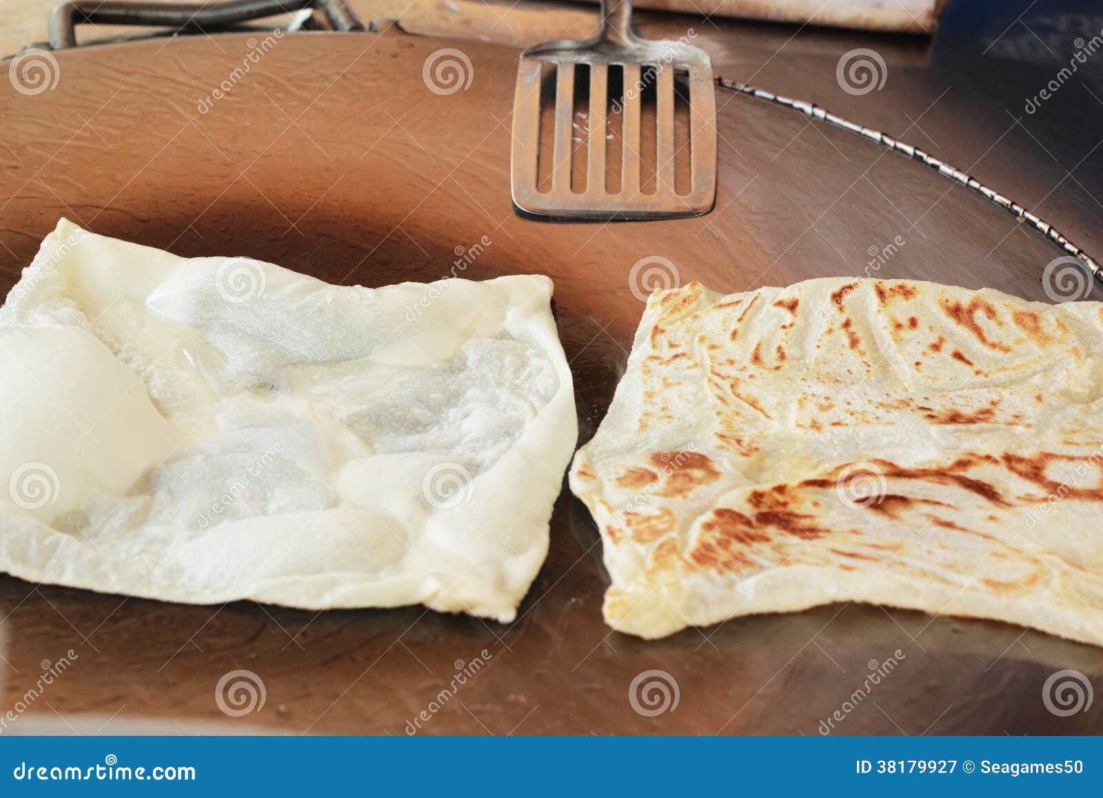 Cooking chapati on the pan stock image. Image of cuisine - 38179927
