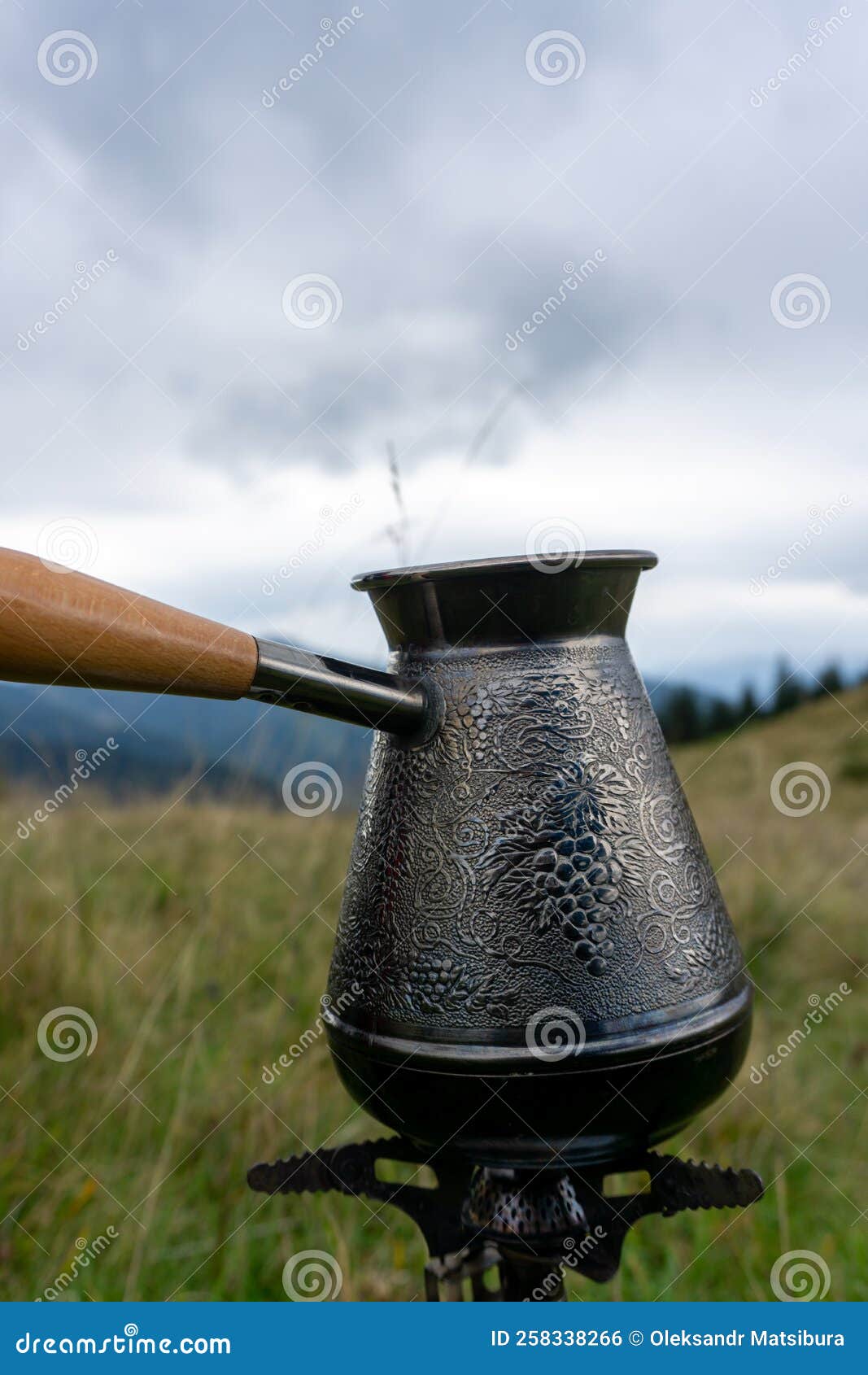 Cooking Coffee in the Coffee Pot Outdoors. Mountain Background Stock ...