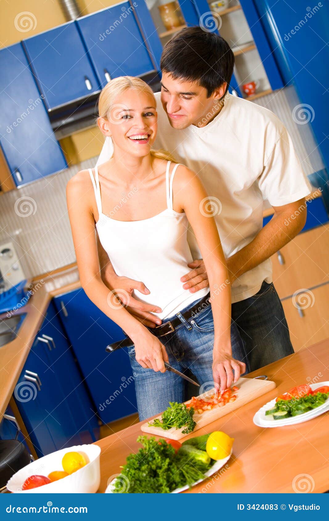 Cooking couple at kitchen stock image. Image of lifestyle - 3424083