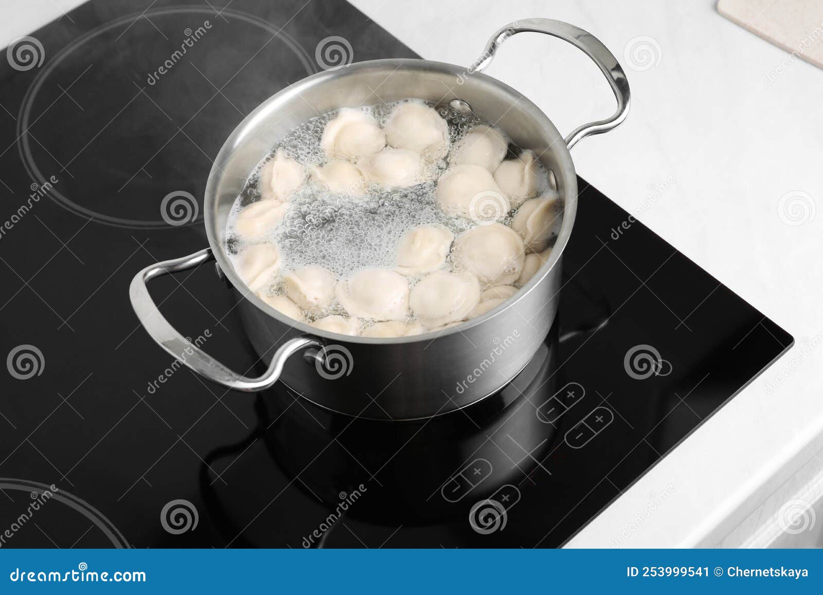 Cooking Delicious Dumplings in Pot on Cooktop Stock Image - Image of ...