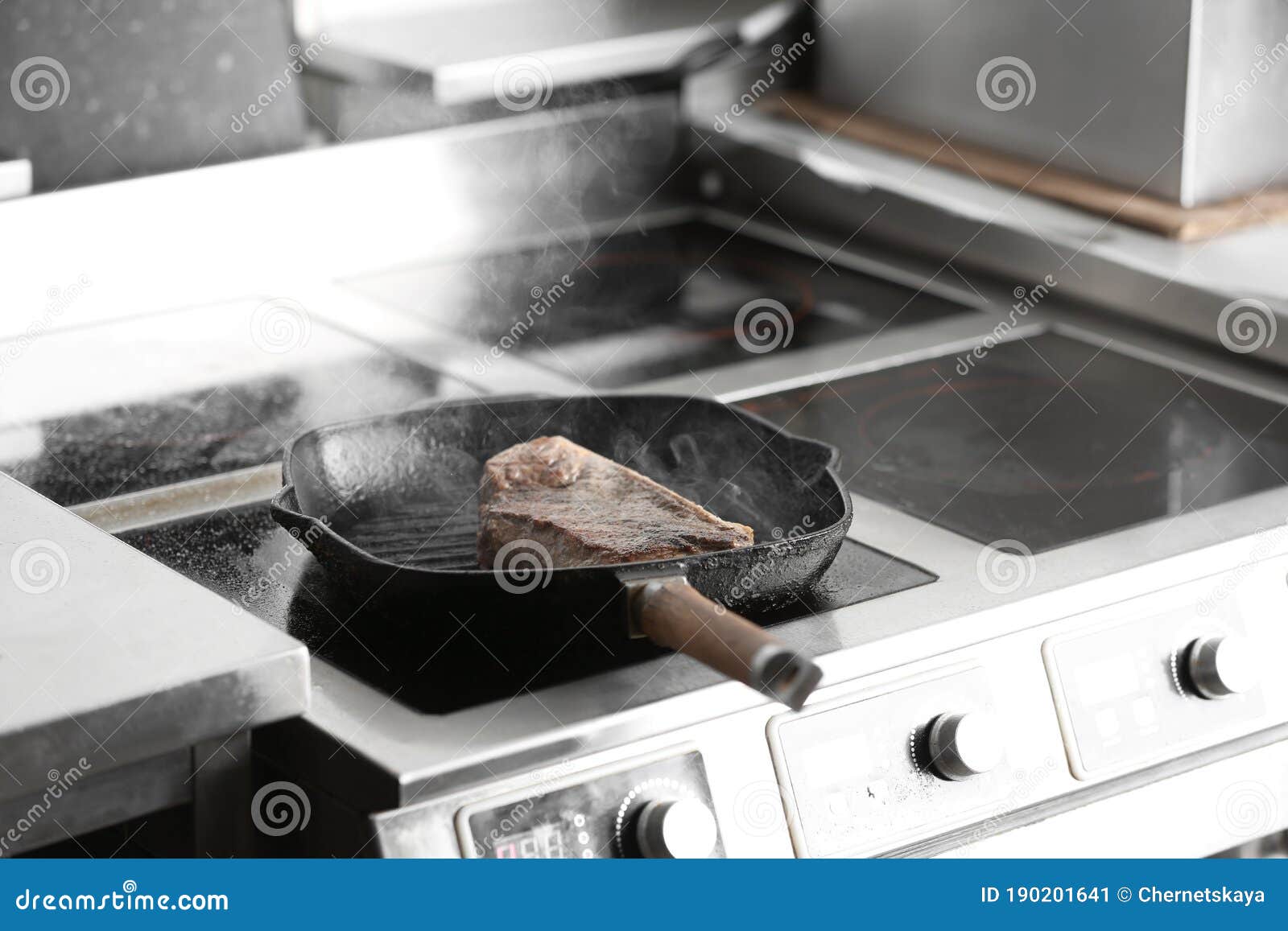 Cooking Meat on Frying Pan in Restaurant Kitchen Stock Image - Image of ...