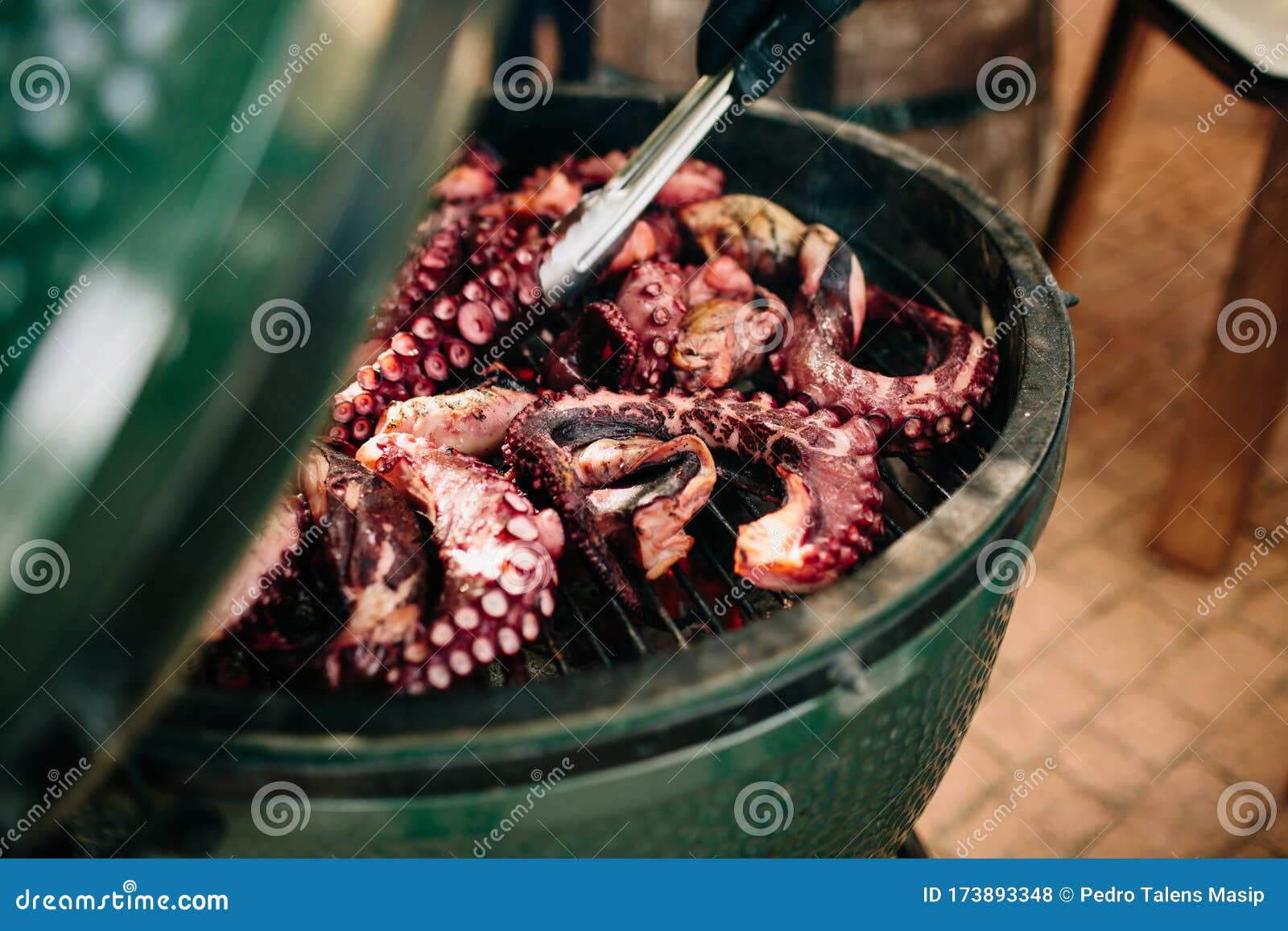 Cooking a Delicious Octopus on a Barbecue Stock Photo - Image of plate ...