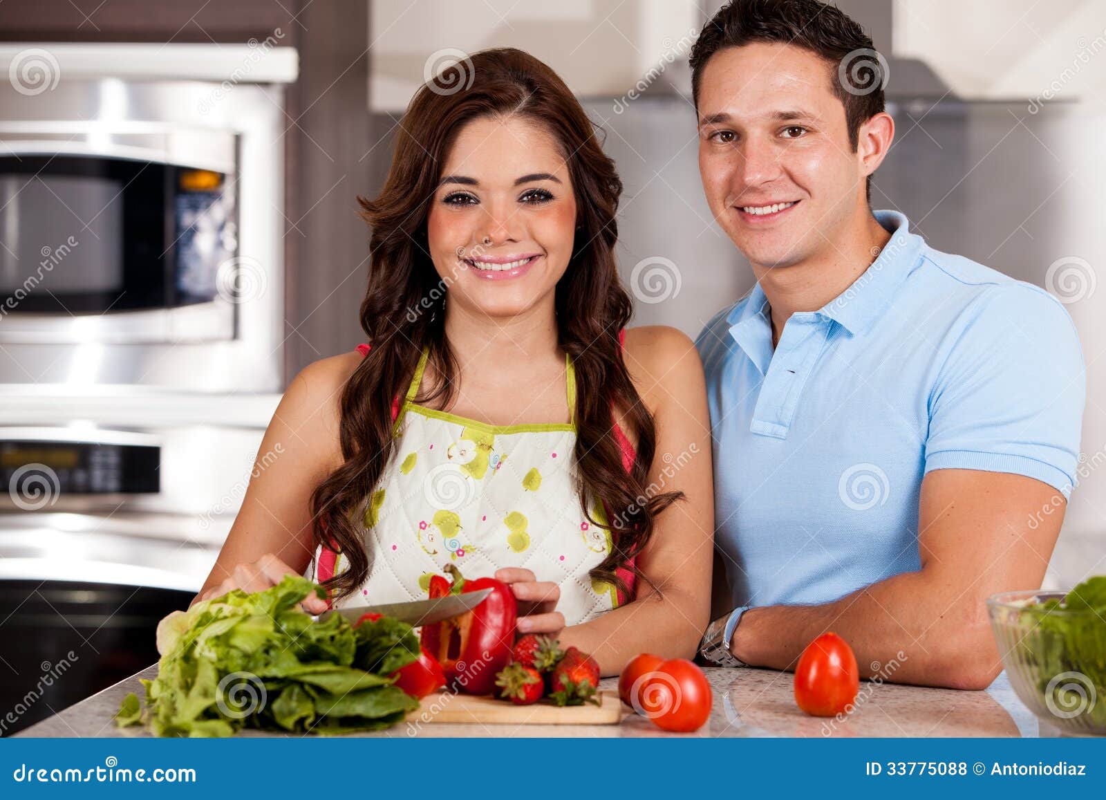 Cooking dinner on a date stock photo. Image of brunette - 33775088