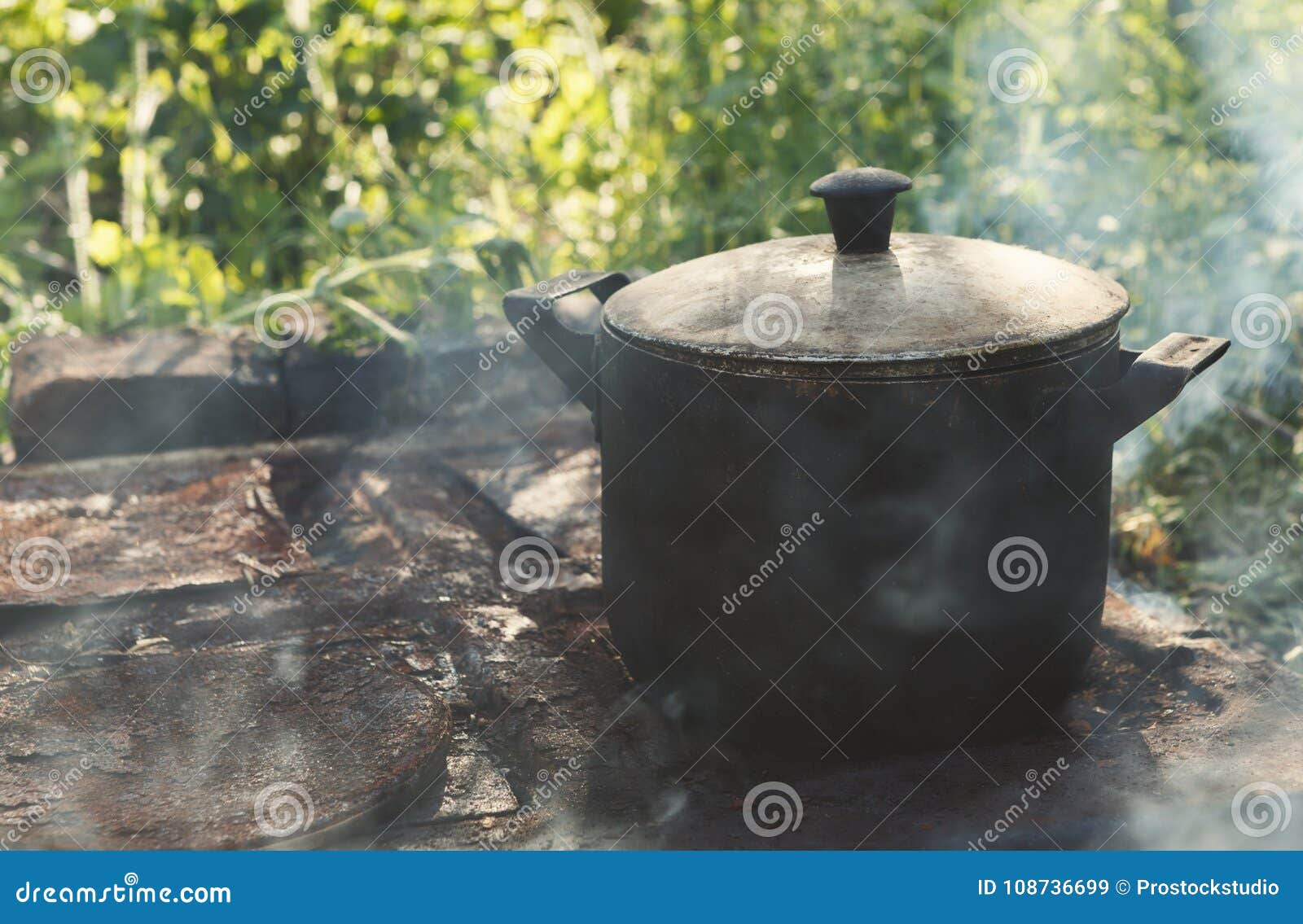Cooking Dinner in Old Camping Kettle on Picnic. Closeup. Stock Image ...