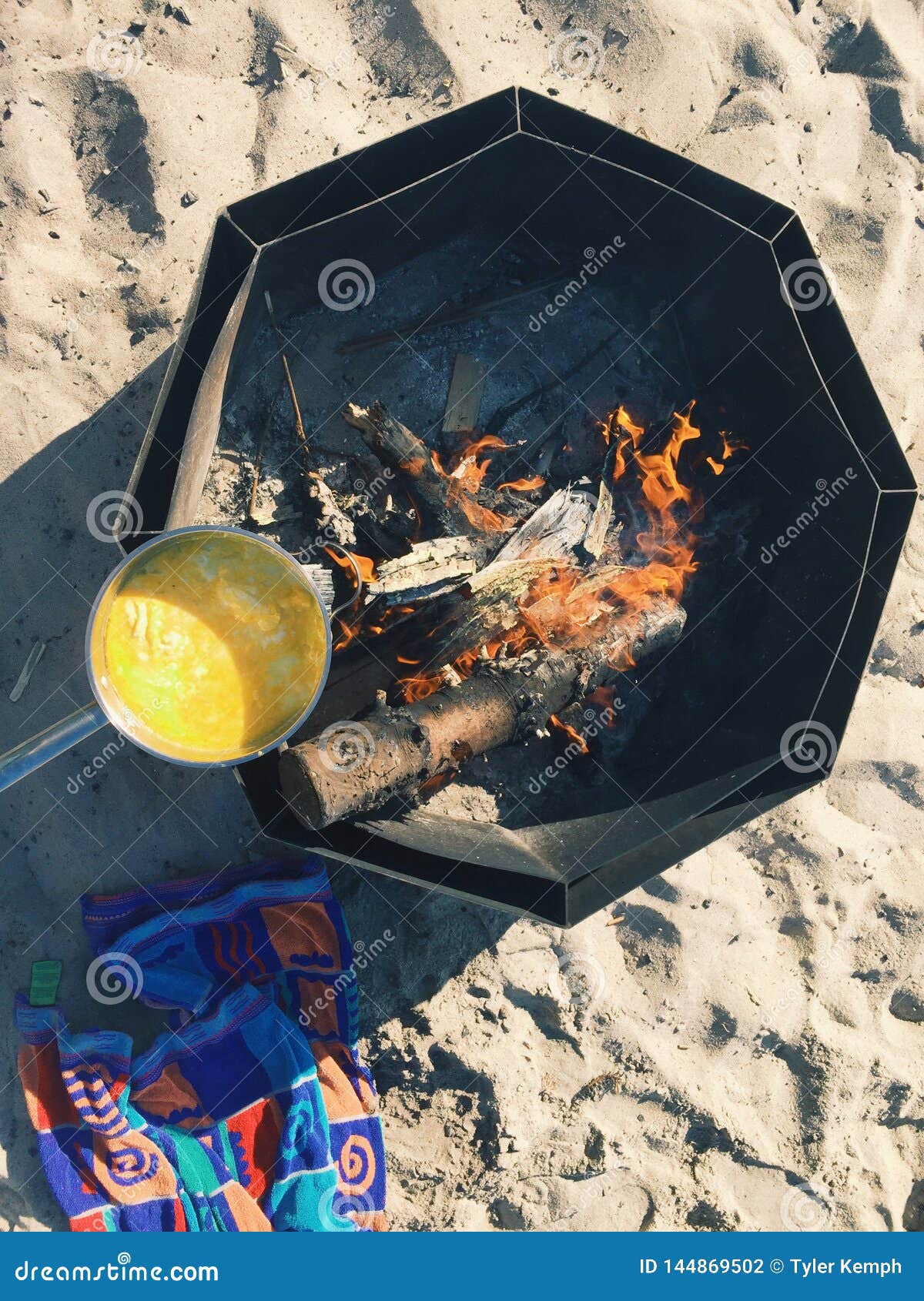 Cooking eggs on the beach stock photo. Image of sand - 144869502