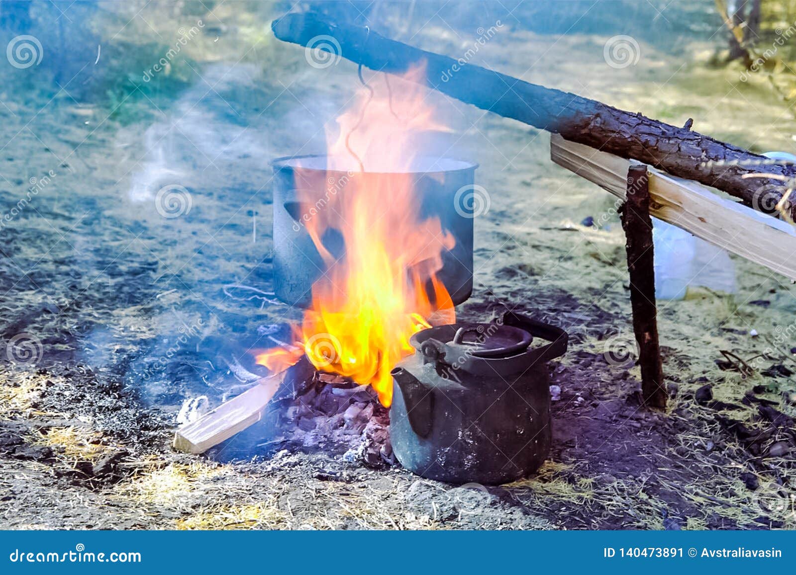 Cooking on a fire in a pot stock image. Image of bowler - 140473891