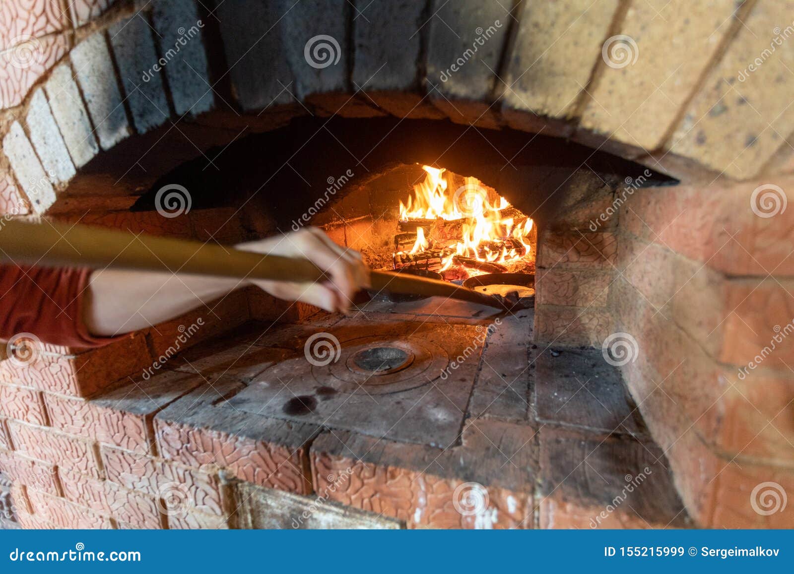 Cooking in the Fireplace. Pancakes in a Pan are Fried on a Fire in the ...