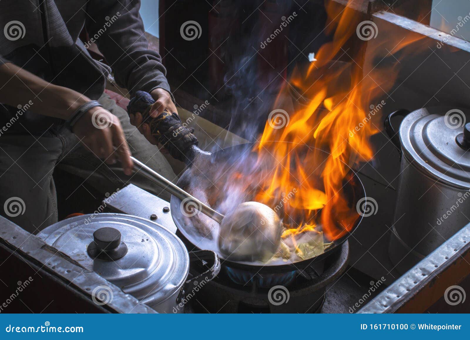 Cooking Flame on the Top of a Wok Stock Photo - Image of person ...