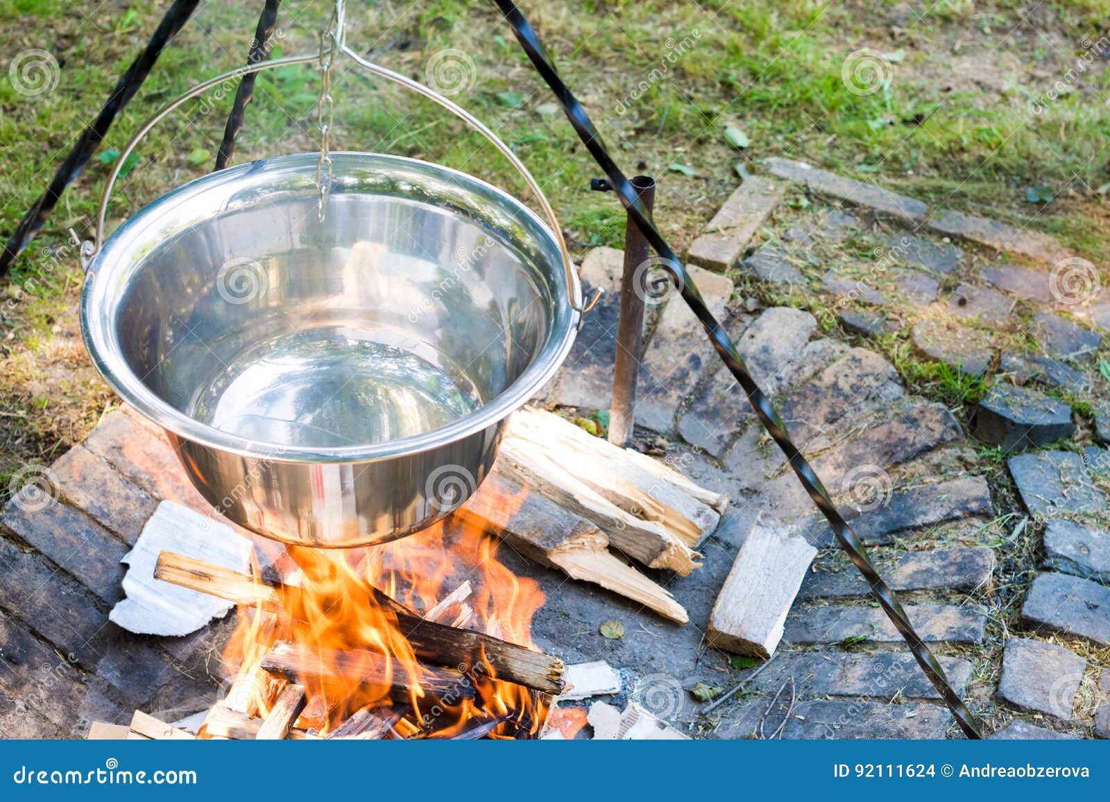 Cooking Food on Fire. Cooking Outdoors in Cast-iron Cauldron. Stock ...