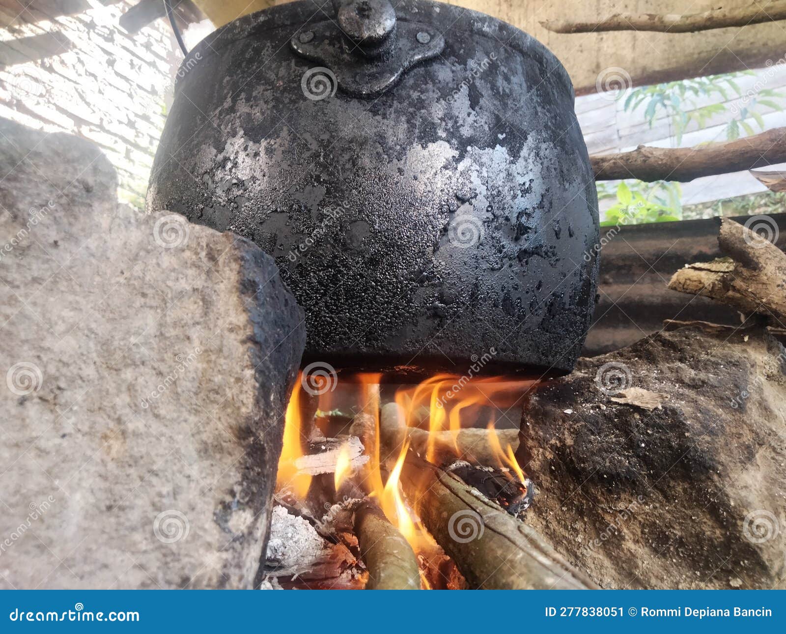 Cooking Food in a Pot with Firewood Using a Three Stone Stove Stock ...