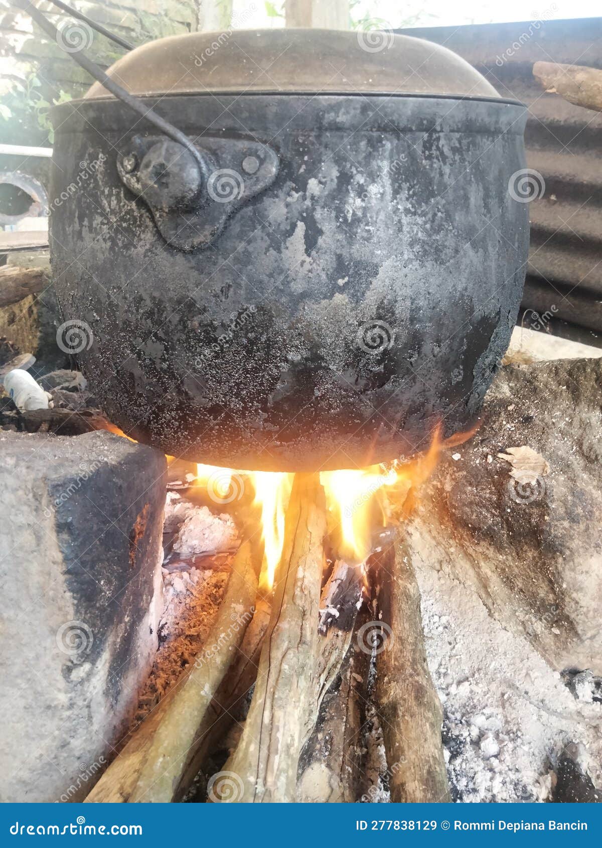 Cooking Food in a Pot with Firewood Using a Three Stone Stove Stock ...
