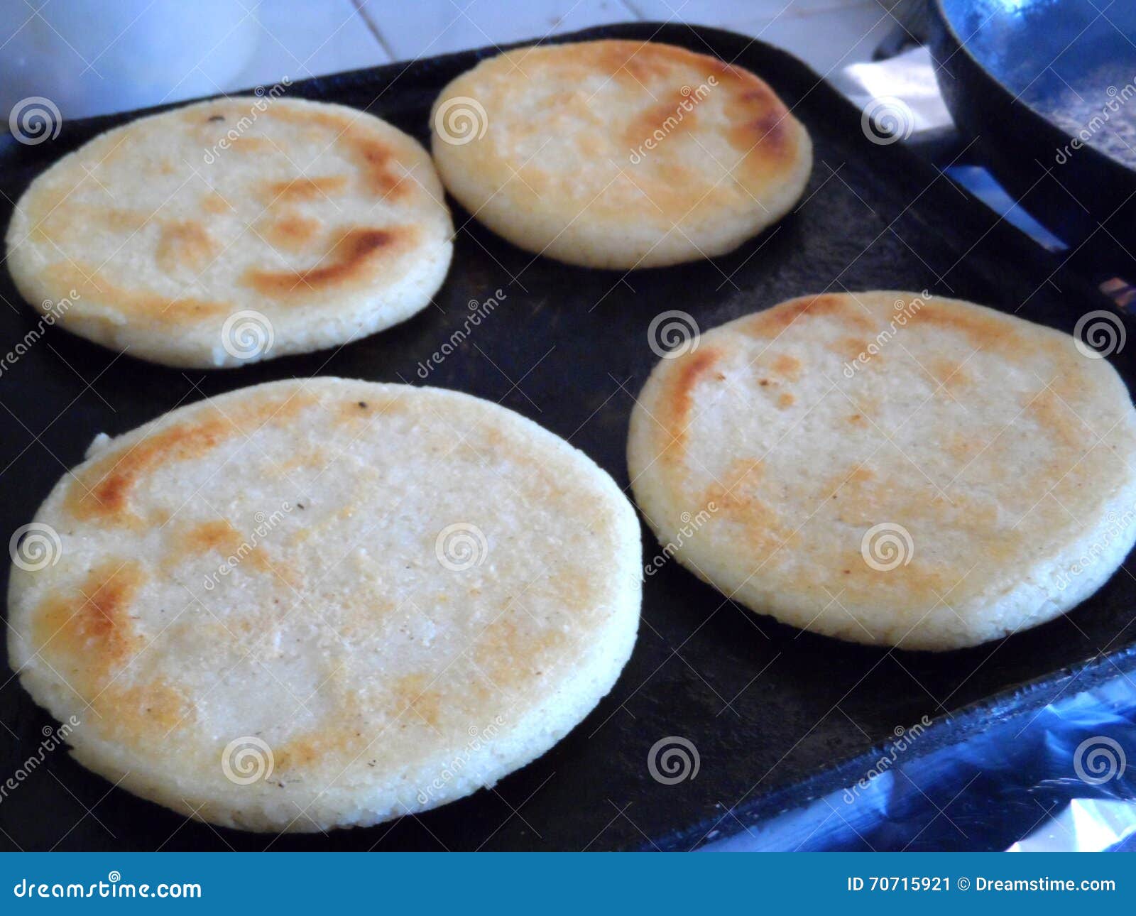 Cooking four arepas stock image. Image of brown, life - 70715921