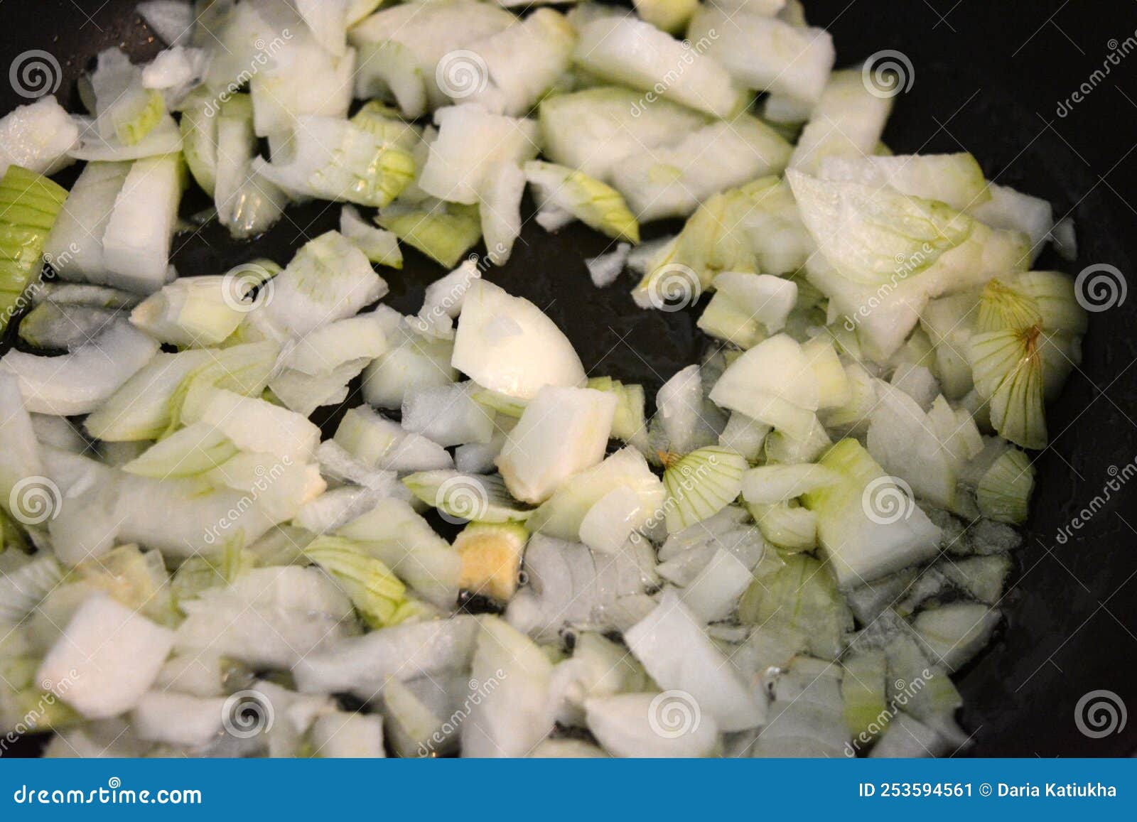 Cooking Healthy Food, Onion is Cut into Cubes and Fried in a Black ...