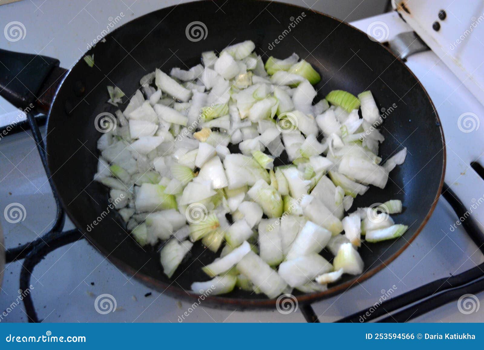 Cooking Healthy Food, Onion is Cut into Cubes and Fried in a Black ...