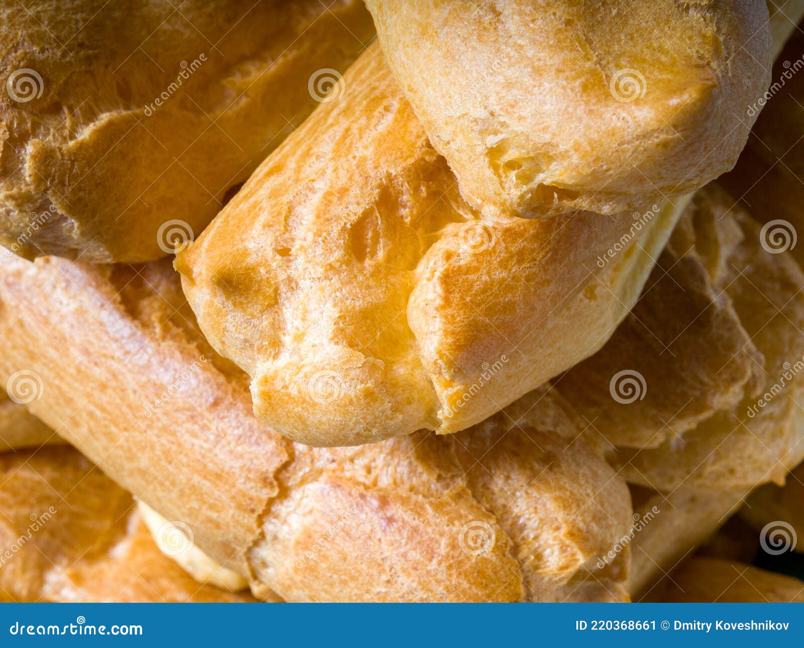 Close-up Stack of Eclairs after Oven Lying on Baking Paper on a Baking ...