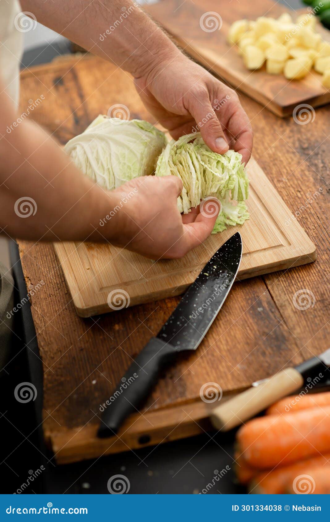Cooking at Home: Dicing Cabbage on a Bamboo Board for Dinner. Stock ...