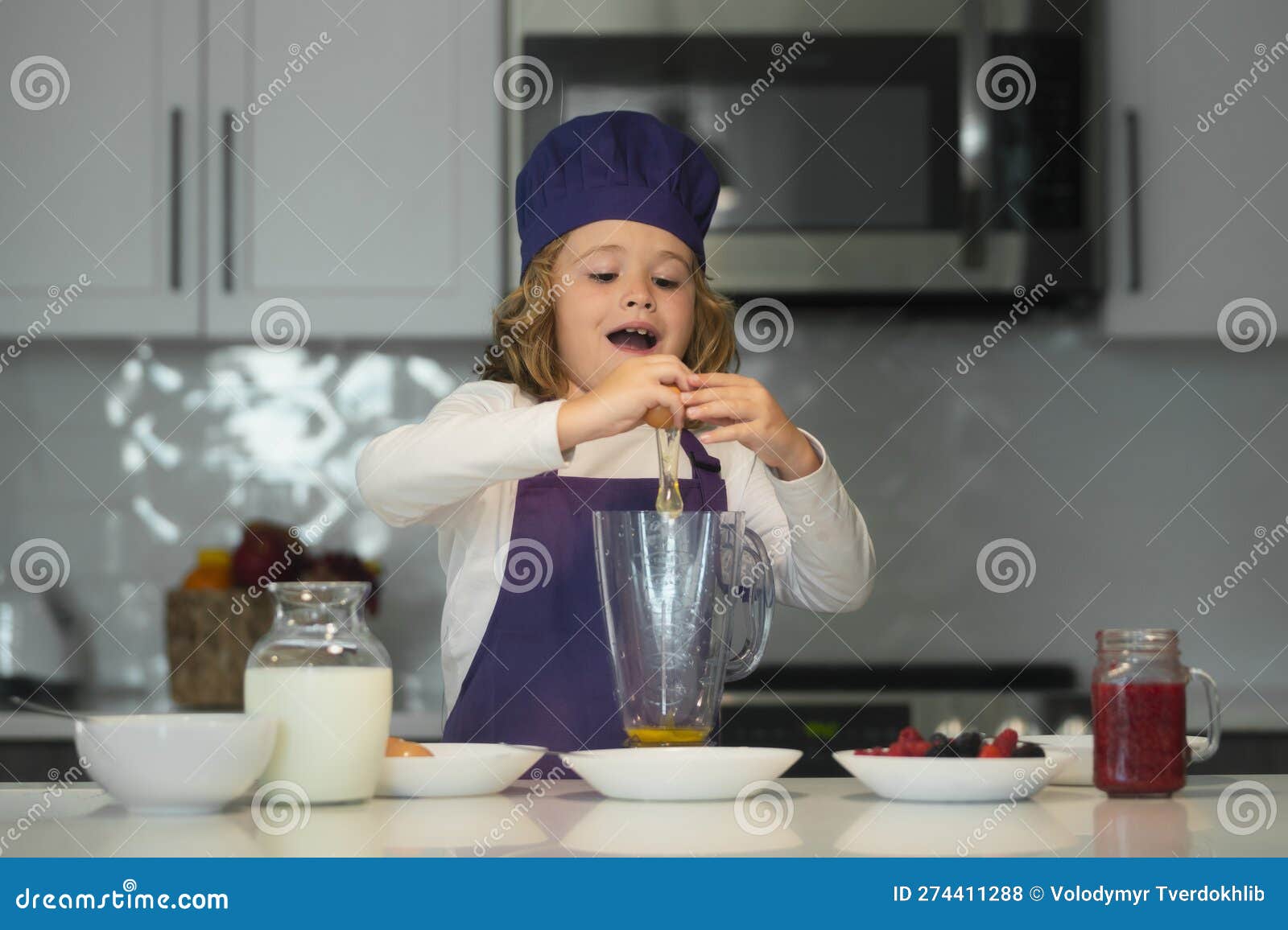 Cooking in Kitchen. Cute Boy Cooking in Kitchen at Home Kitchen. Stock ...