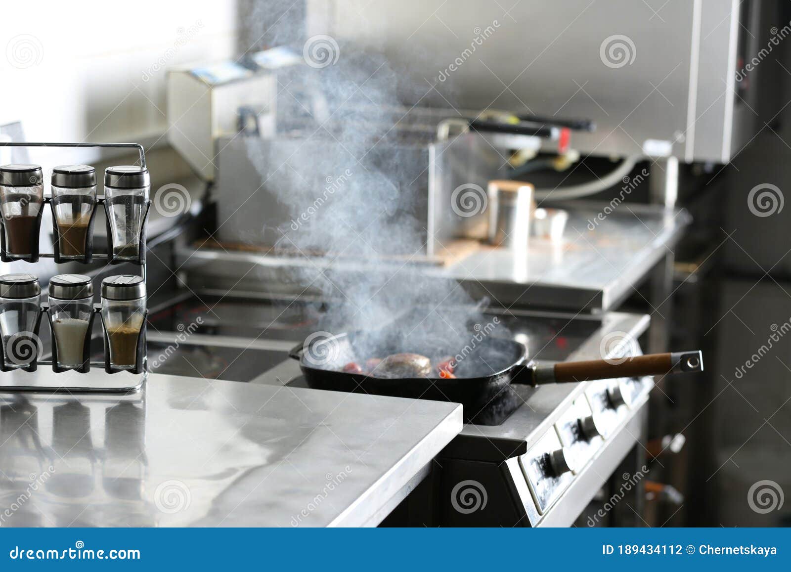 Cooking Meat on Frying Pan in Kitchen Stock Photo - Image of healthy ...