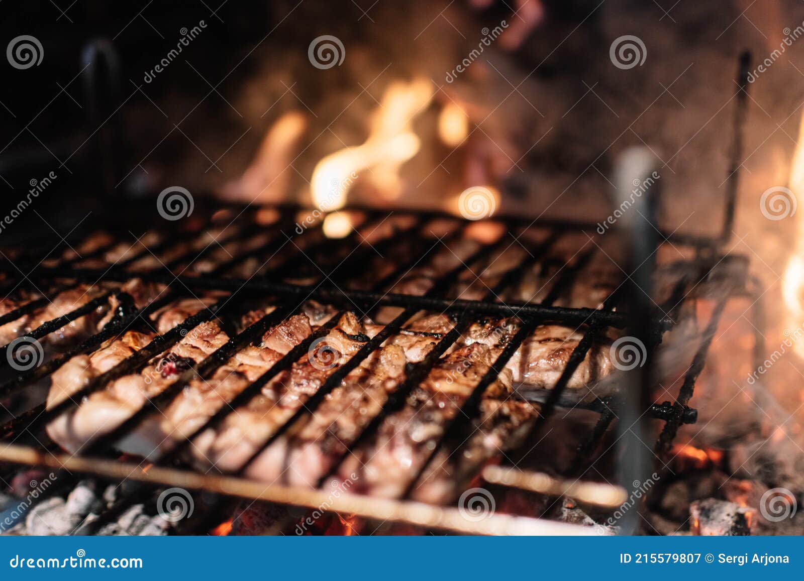 Cooking Meat on the Grill in a Fireplace with Embers Stock Image ...