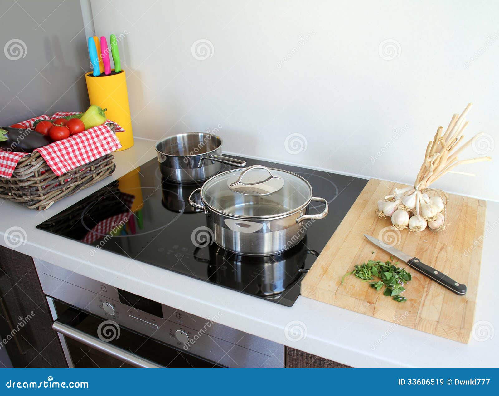 Cooking in modern kitchen stock image. Image of induction - 33606519