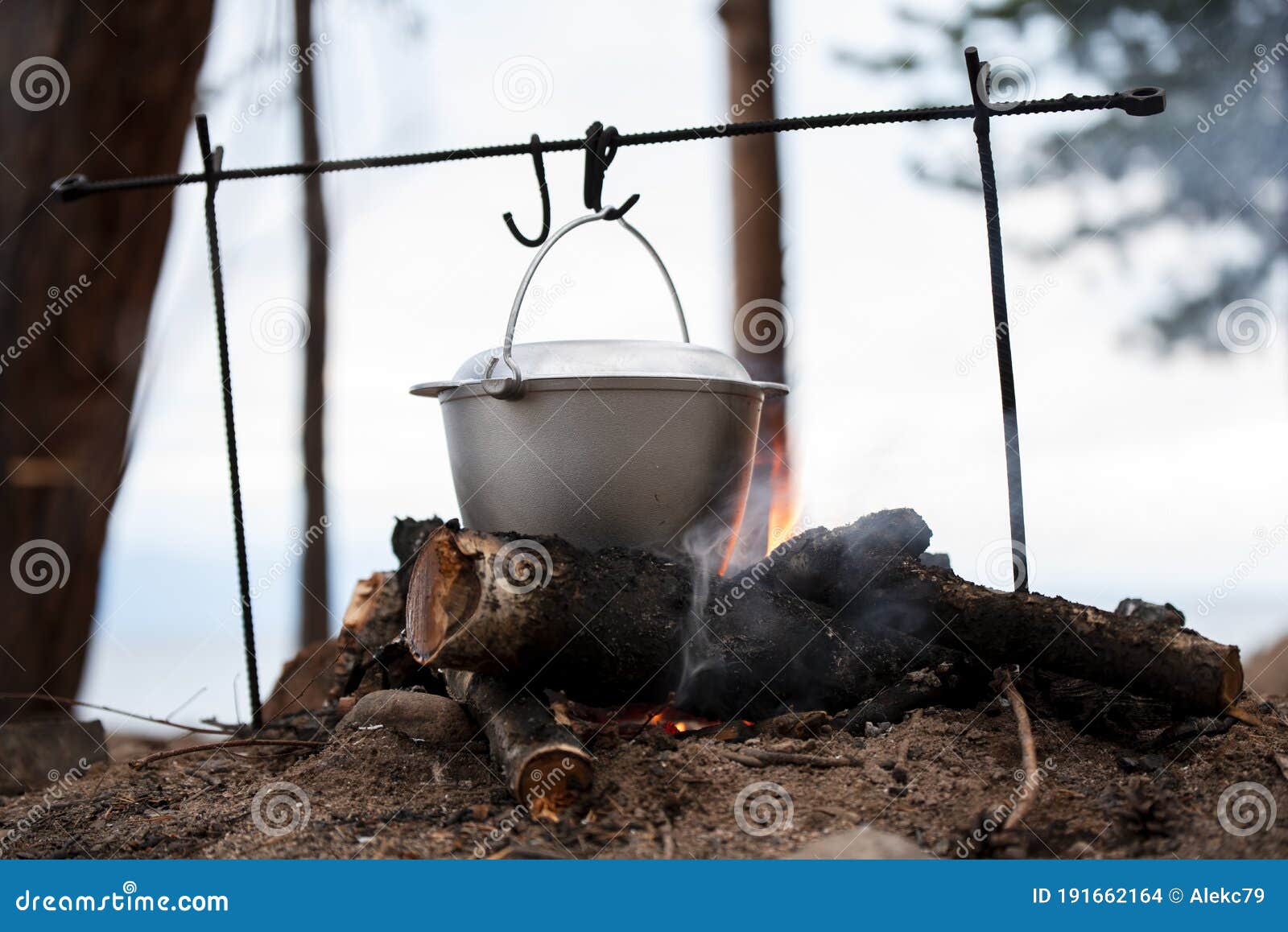 Cooking Over a Fire in a Pot Stock Photo - Image of camping, dinner ...