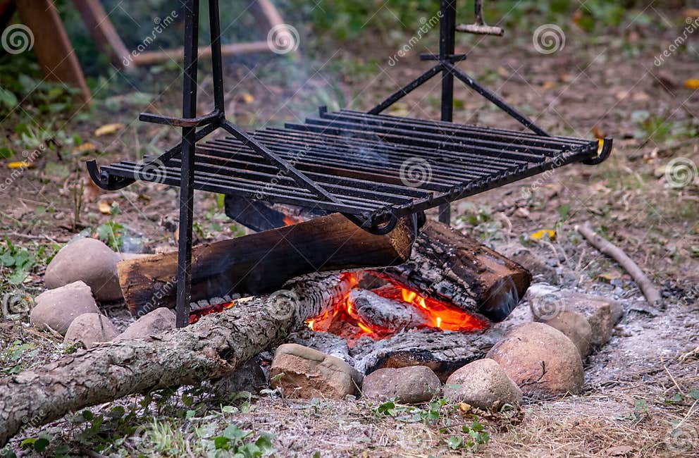 Cooking over a open fire stock photo. Image of metal - 320353952