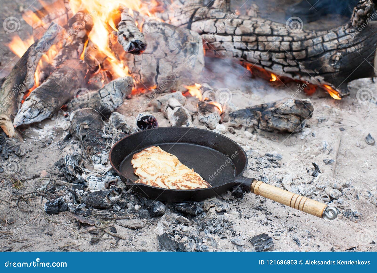 Cooking Pancakes on the Fire in the Forest. Stock Image - Image of ...