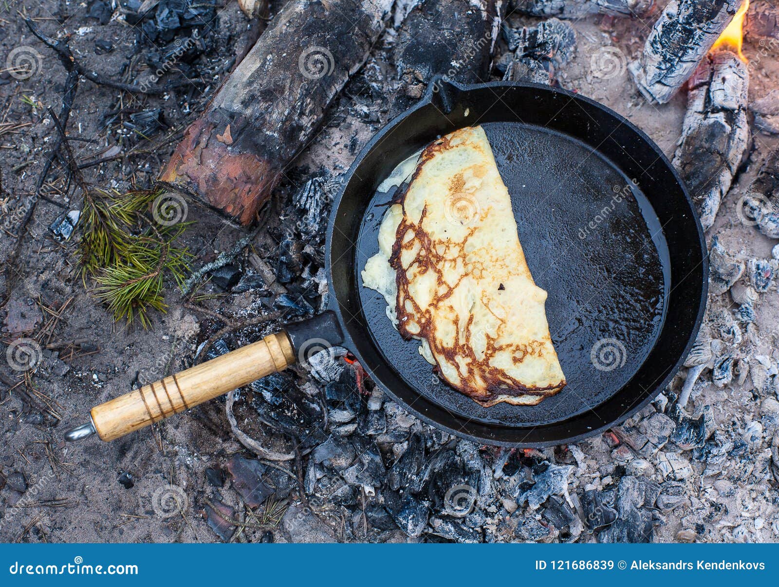 Cooking Pancakes on the Fire in the Forest. Stock Image - Image of ...
