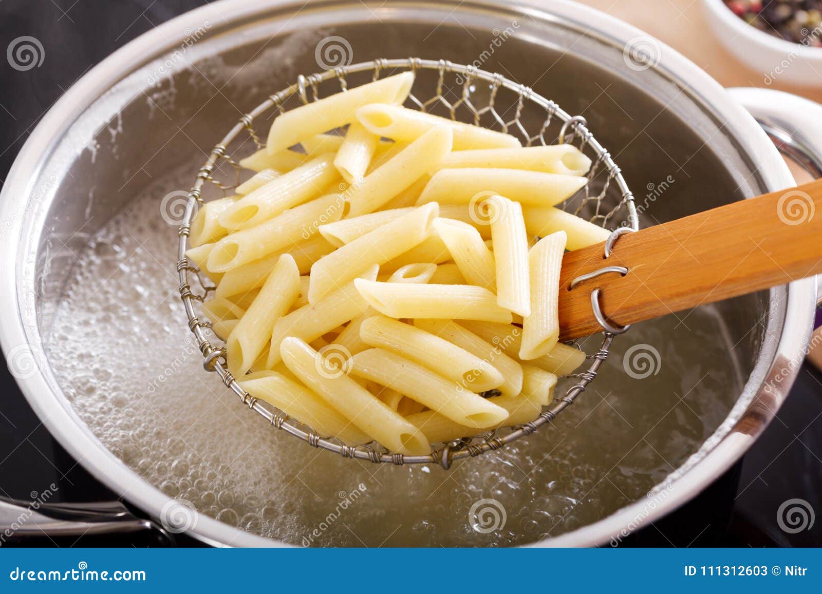Cooking pasta in a pot stock image. Image of spaghetti - 111312603