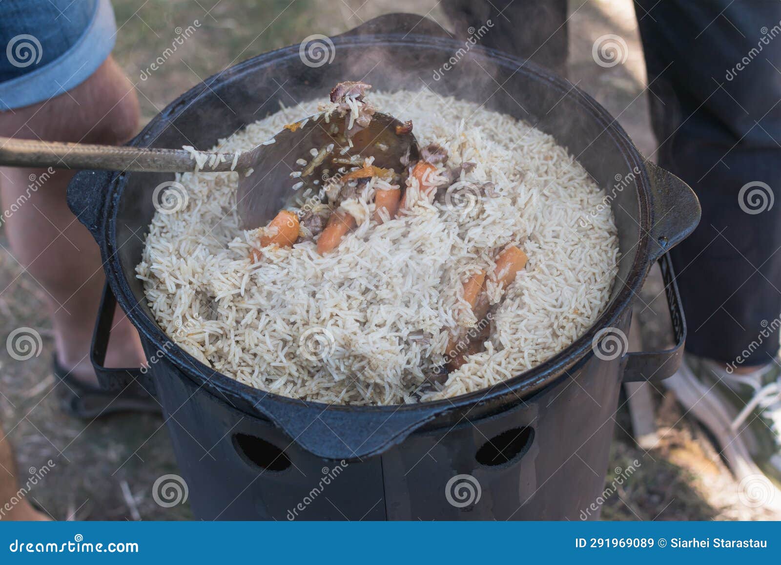 Cooking Pilaf in a Cauldron in the Courtyard of the House Stock Image ...