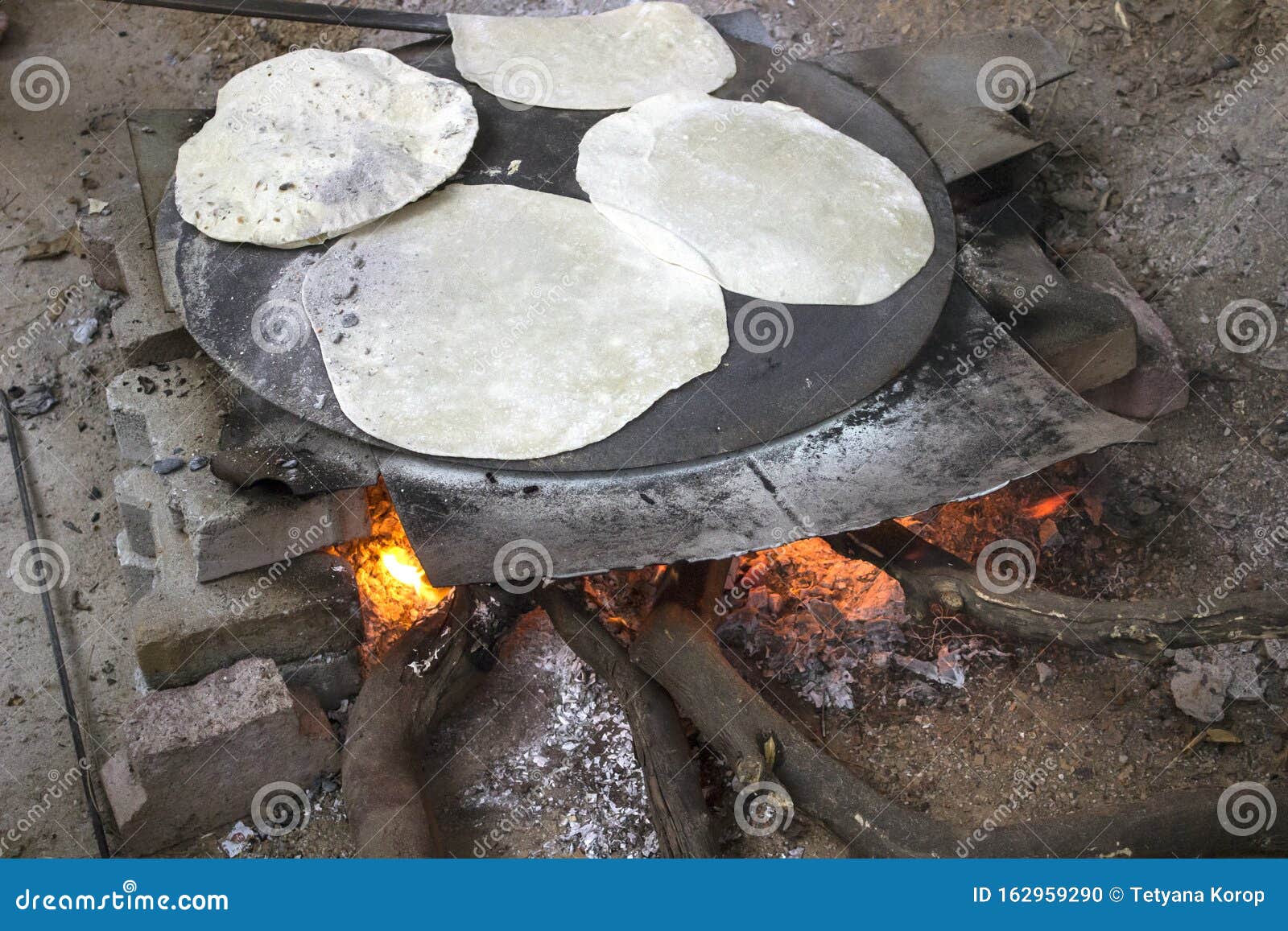 Cooking Pita Bread Over an Open Fire Stock Photo - Image of cook ...