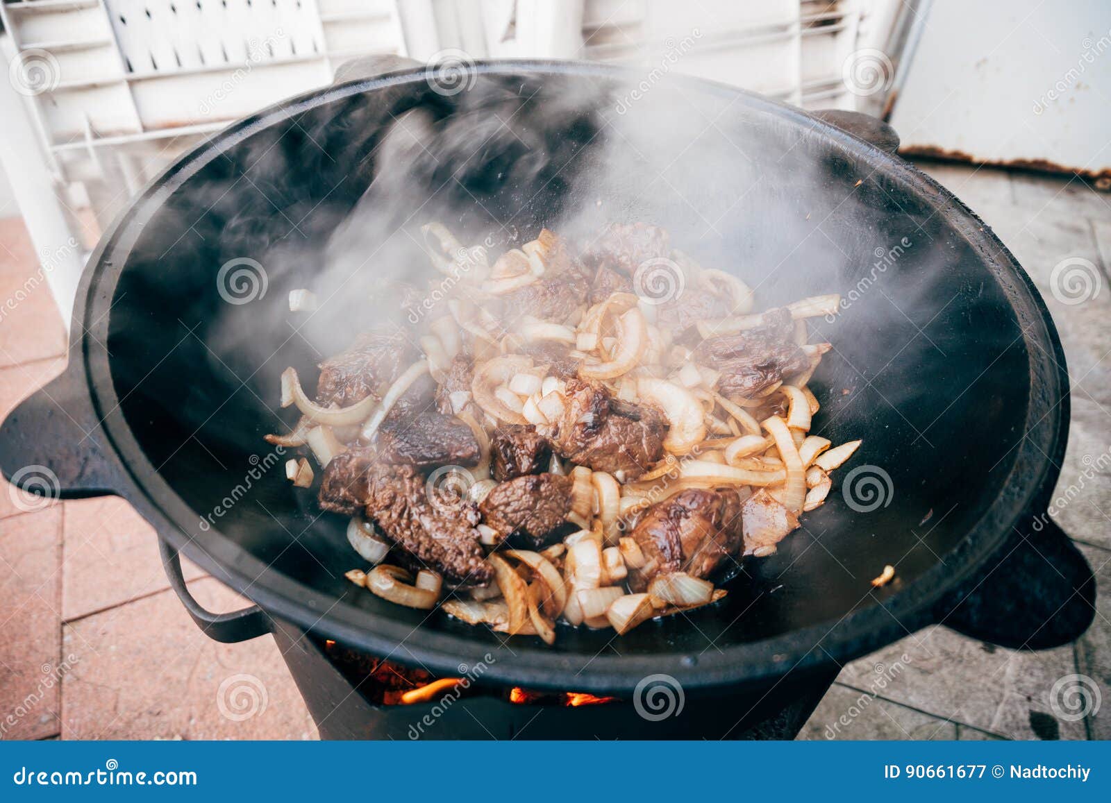 Cooking Plov in the Cauldron. only Meat and Onions in a Cauldron Stock ...
