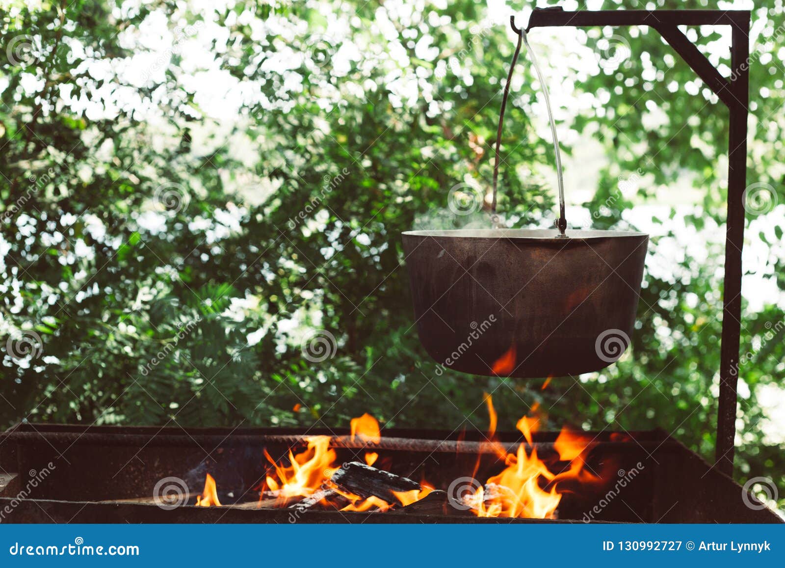 Cooking in a Pot on the Fire Stock Image - Image of metal, fire: 130992727