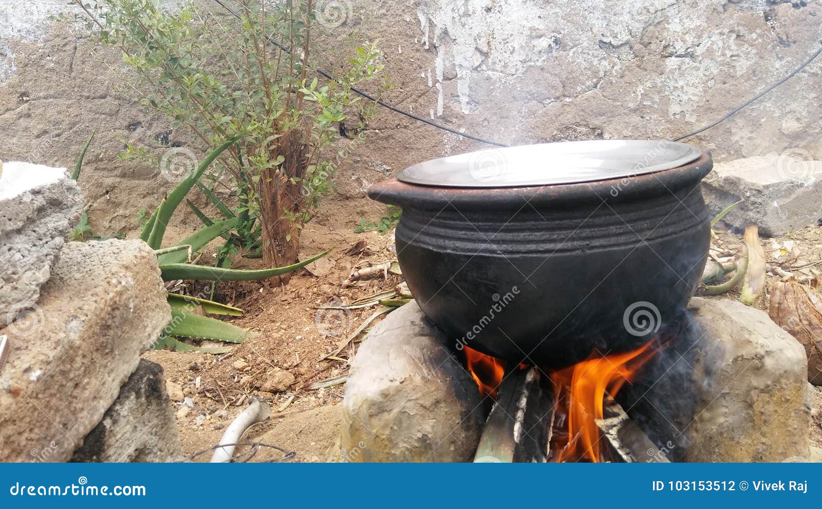 Cooking in pot stock photo. Image of wood, flame, village - 103153512