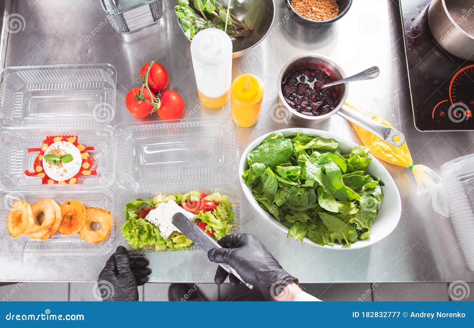 Cooking in a Restaurant and Packing in a Container for Delivery Stock ...