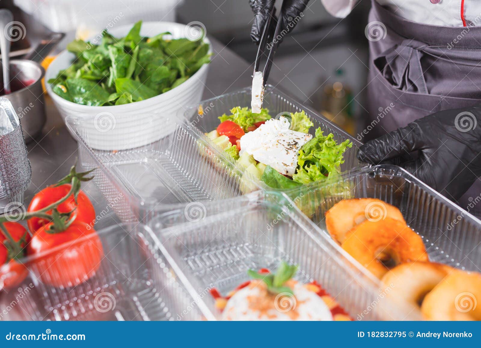 Cooking in a Restaurant and Packing in a Container for Delivery Stock ...